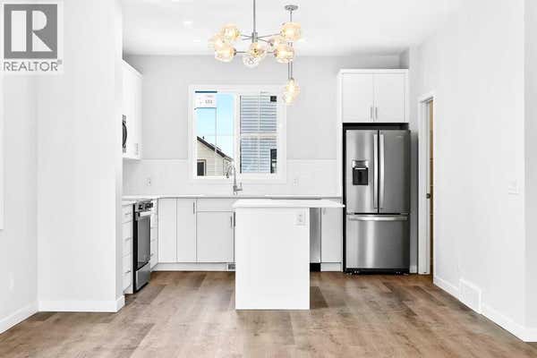 107, 40 CREEKSIDE WAY SW, CALGARY, AB T2X 6E2 House For Sale | REMAX ...